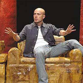 Joel Trinidad stars in Defending the Caveman, on stage starting May 6